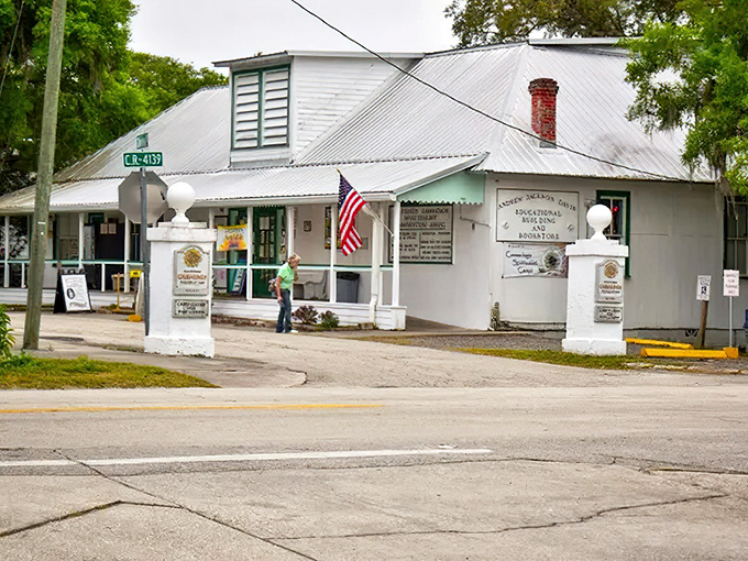 The bookstore entrance beckons with promises of enlightenment, its white clapboard simplicity belying the metaphysical treasures within.