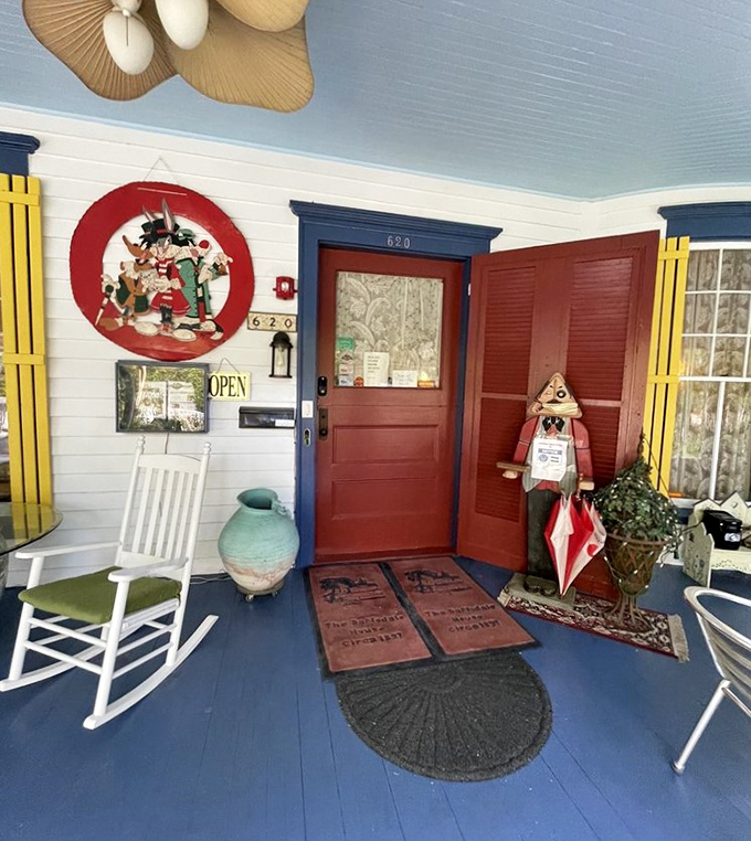 The welcoming front entrance features a classic rocking chair and whimsical decorations&mdash;the first hint that this is no ordinary bed and breakfast experience.