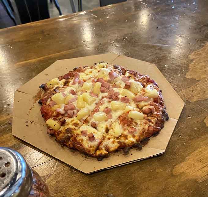 Hawaiian pizza brings the sweet-and-savory debate to your table, loaded with ham and pineapple for the brave.