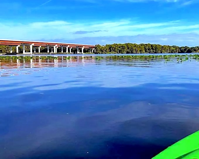 The serene waters of Lake Monroe reflect the blue Florida sky, belying the supernatural reputation of the nearby Dead Zone.