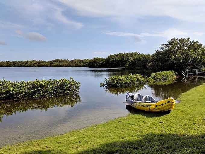 That inflatable kayak sitting ready by the water is basically screaming "adventure awaits," and who are you to argue with an enthusiastic watercraft?