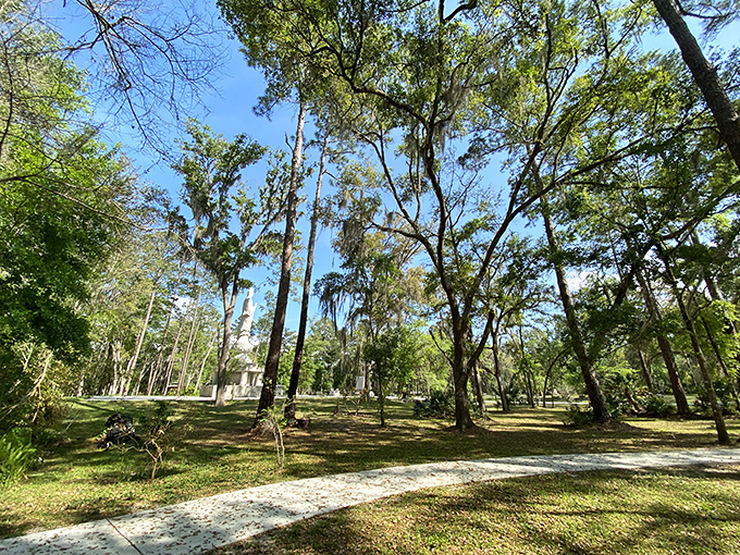 Natural pathways wind through the property, where towering pines and native plants create a distinctly Floridian setting for Eastern spirituality.