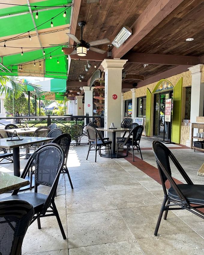 The outdoor patio offers a breezy Florida setting for savoring Caribbean-inspired dishes under gently swaying palms and string lights.