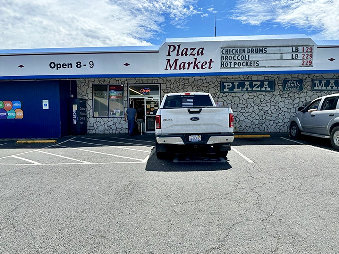 Plaza Market serves as Eatonville's everyday gathering spot, where locals shop for essentials and exchange the currency of community news.