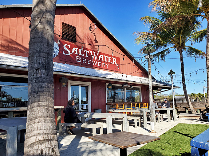 SaltWater Brewery's rustic red barn houses liquid gold crafted with local passion, where outdoor tables invite lingering conversations.