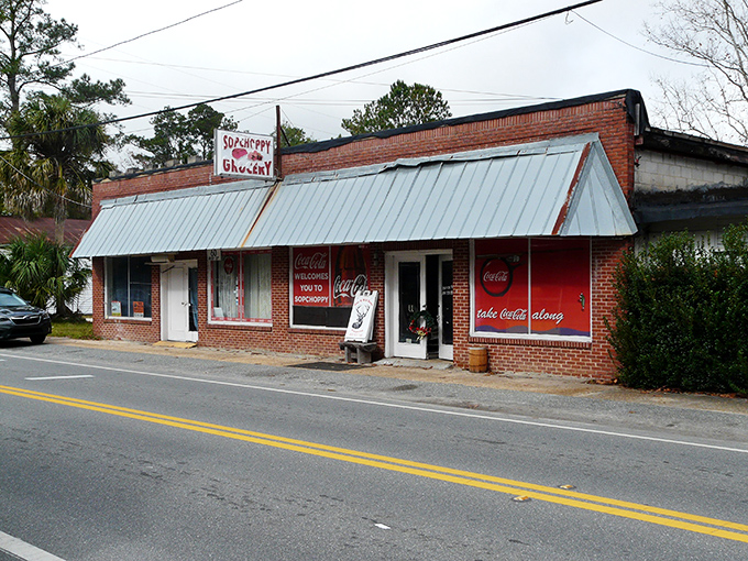 The Sopchoppy Grocery stands as a brick-and-mortar time capsule, where Coca-Cola signs and community notices share equal billing.