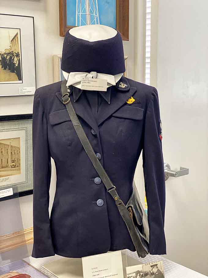 A genuine WAVES uniform stands ready, representing the women who answered their country's call when it needed all hands on deck.