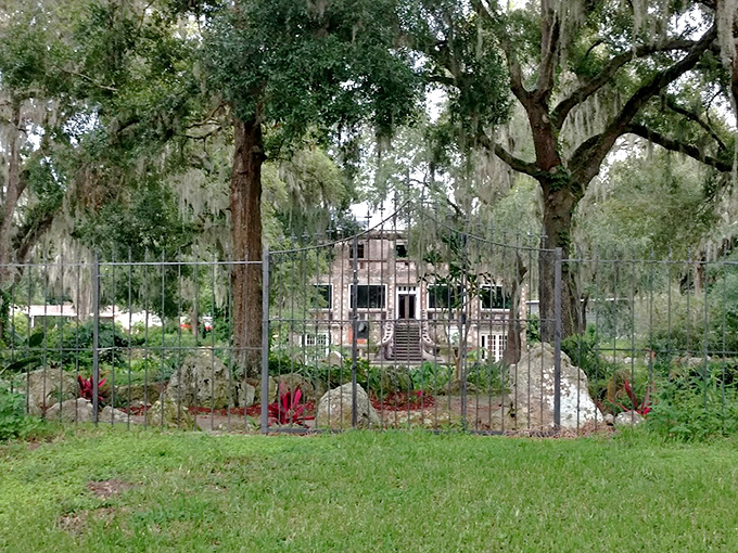 Glimpsed through iron bars, the Wonder House takes on a forbidden quality &ndash; part abandoned castle, part tropical fever dream.