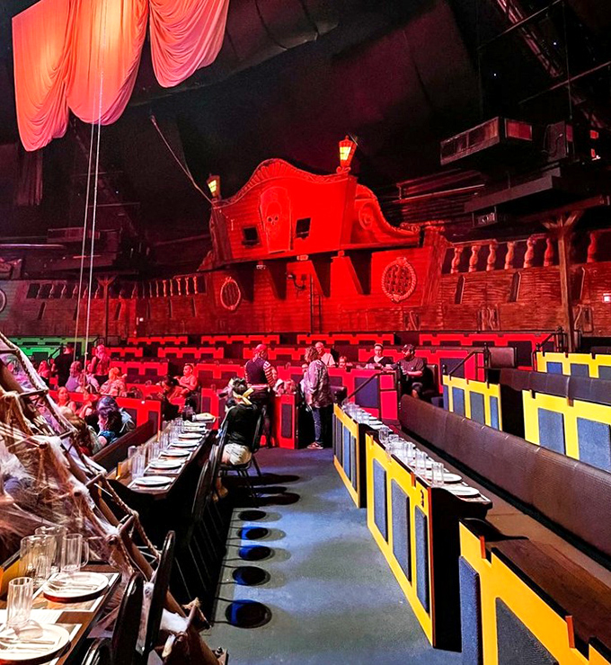 The impressive theater setup reveals tiered seating surrounding the massive Spanish galleon &ndash; your dining room for this evening's adventure.