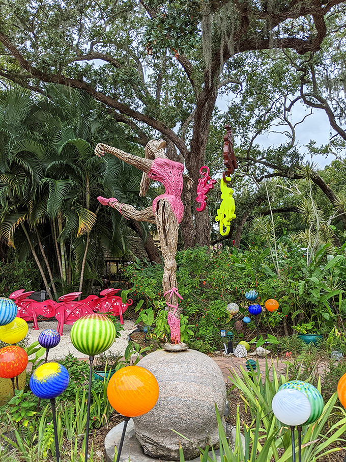 Where else can you find a pink dancer pirouetting among colorful glass orbs? This garden brings Alice's Wonderland to Florida with whimsical flair.