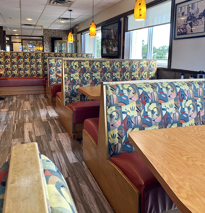 The abstract art upholstery and burgundy vinyl booths create the perfect setting for both first dates and philosophical discussions about whether pie is better than cake.
