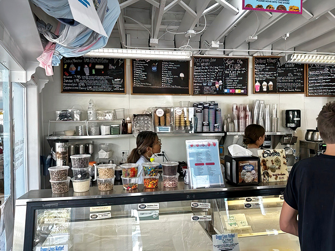 Behind this counter, sandwich artists work their magic, transforming simple ingredients into edible masterpieces with practiced precision.
