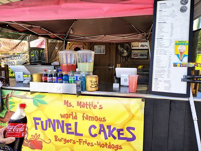 Ms. Mattie's food stand serves up comfort classics with a side of nostalgia. Those funnel cakes aren't just dessert – they're powdered sugar memories in the making.
