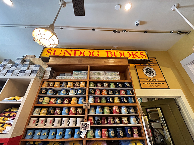 Handcrafted mugs line shelves like a ceramic rainbow &ndash; morning coffee tastes better when sipped from a vessel with character and coastal charm.