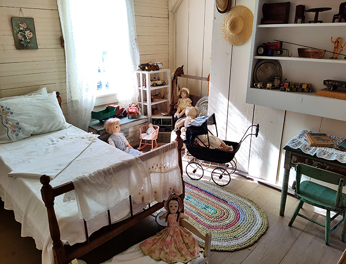 The children's room showcases handmade dolls and toys that entertained generations without batteries, charging cables, or software updates.