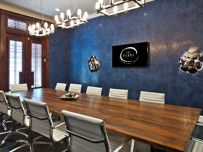 Business meetings get a coastal upgrade in this elegant space where productivity meets undeniable style.