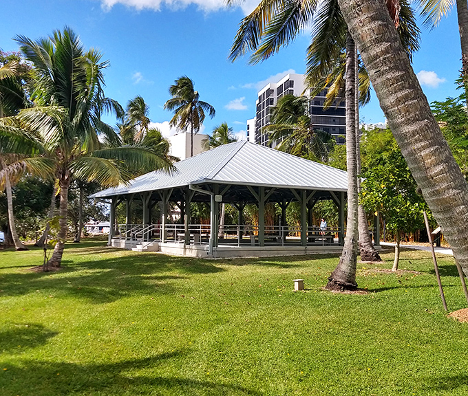 This charming gazebo offers shade and river views, a perfect spot for contemplating how two friends' winter getaway became an American treasure.