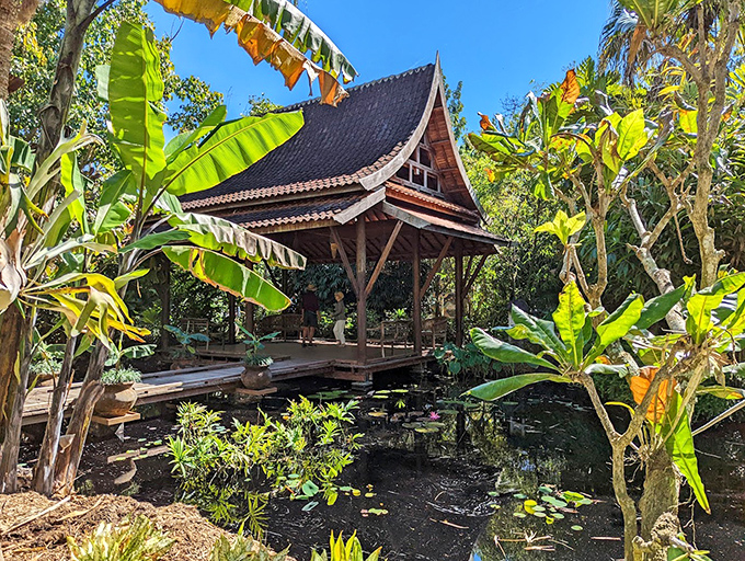 This authentic Thai structure offers tranquil reflection over lily-dotted waters, transporting visitors to Southeast Asia.
