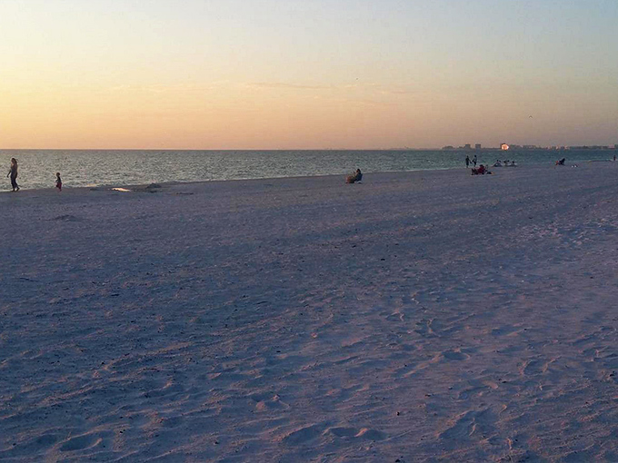 As day winds down, Pass-A-Grille Beach transforms into a canvas of long shadows and golden light.