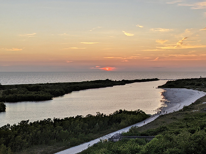 The view from elevated areas reveals the lagoon's protected waters meeting the Gulf, creating a landscape that looks professionally designed by nature.