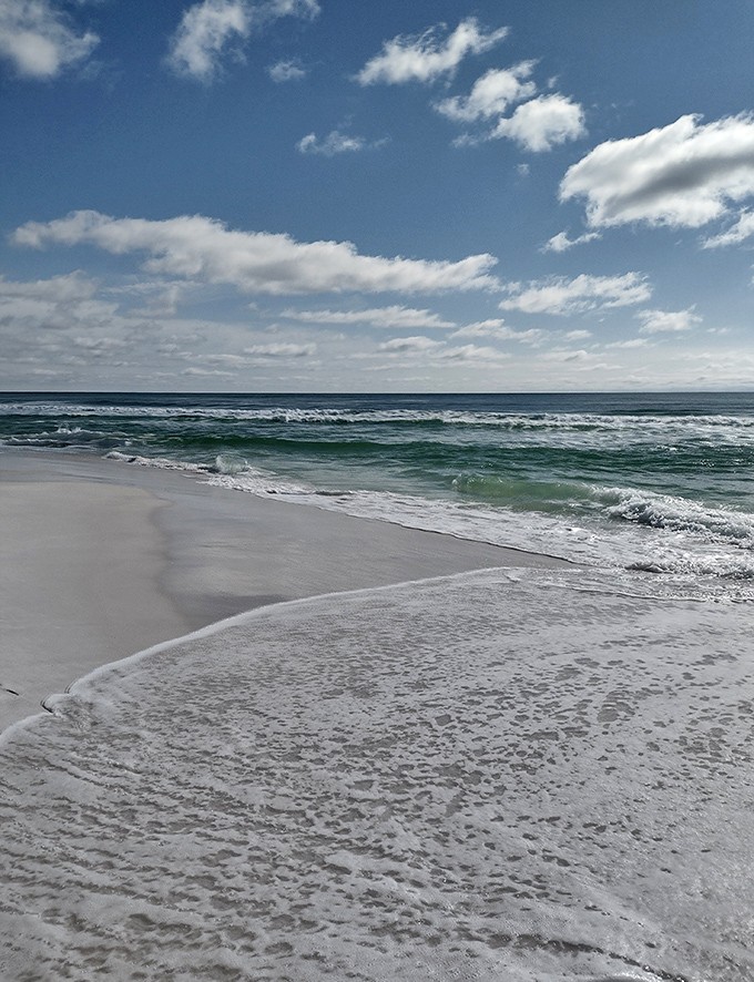 The shoreline where footprints wash away daily, nature's gentle reminder that we all get fresh starts.