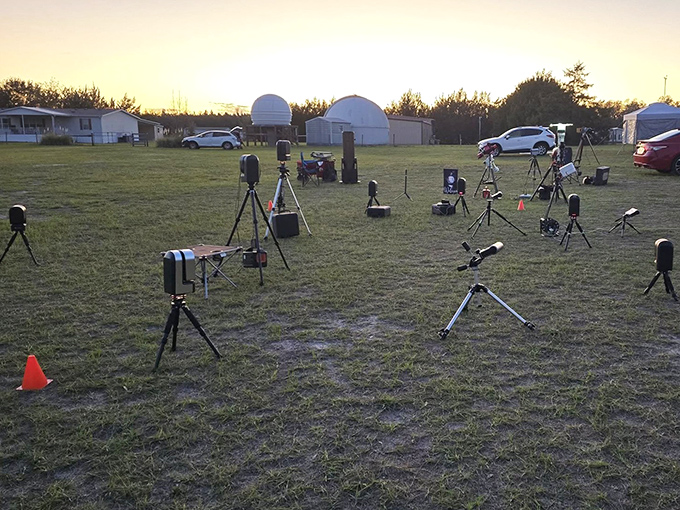 A forest of tripods and telescopes stands ready for nightfall, each instrument aimed at a different cosmic neighborhood.