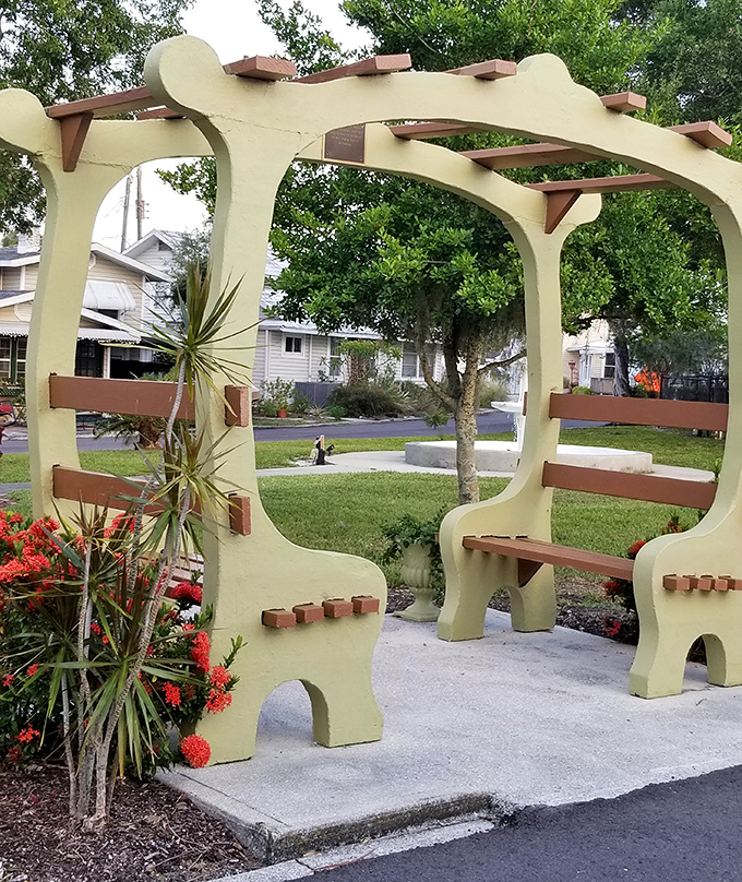 Whimsical outdoor seating area blends architectural playfulness with practical design, offering a moment's rest during your historical exploration.