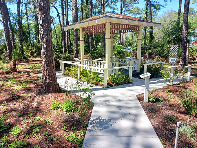 A charming gazebo offers respite from the Florida sun, inviting visitors to pause and soak in the surrounding botanical symphony.