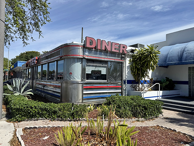 Jack's Hollywood Diner's authentic stainless steel car gleams in the sunshine, a perfectly preserved slice of Americana just waiting to serve up nostalgia.