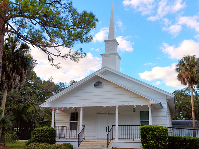 Simple white steeple reaching skyward, Aripeka's Baptist Church reminds visitors that faith and community remain cornerstone values here.