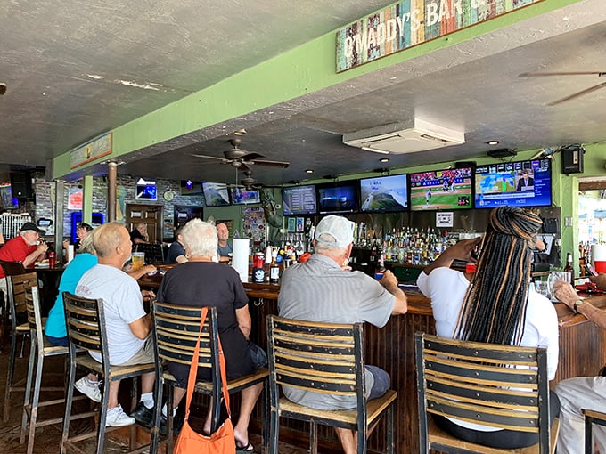 Bar Area: Where locals share fishing tales that grow taller with each round, beneath ceiling fans that spin stories of their own.