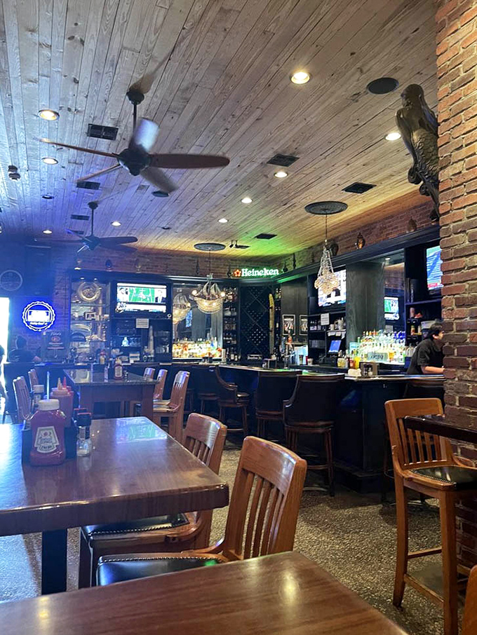 The bar area's warm wooden tones and crystal chandeliers create an unexpected but delightful contrast.