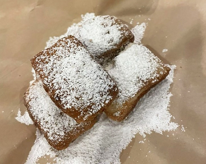 Powdered sugar-dusted beignets provide a sweet epilogue to your meal &ndash; light, airy pastries that practically float off the plate.