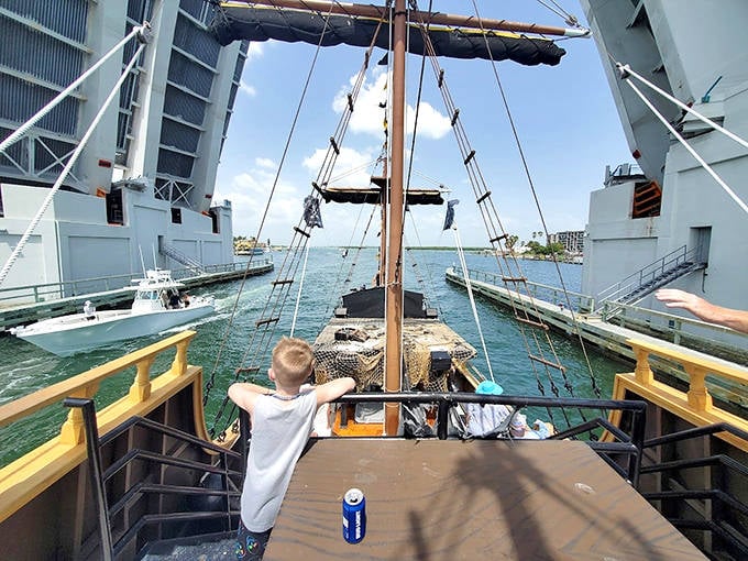 Cruising under the bridge to your beachside adventure, where modern infrastructure meets swashbuckling imagination in perfect harmony.
