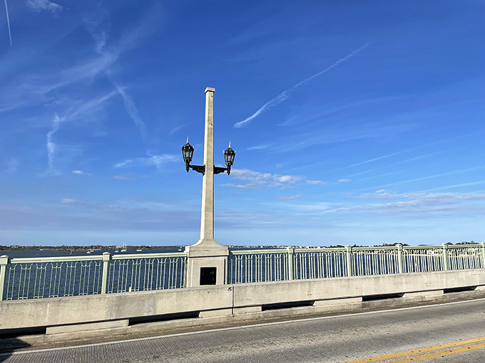 The bridge's distinctive towers and lampposts create a rhythm of vertical elements that draw the eye across the span.