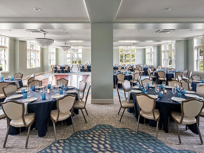 The Caladesi Ballroom awaits its next celebration, tables elegantly arranged beneath sparkling chandeliers.