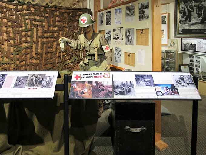 World War II medical displays honor those who ran toward danger carrying stretchers instead of weapons, saving countless lives.
