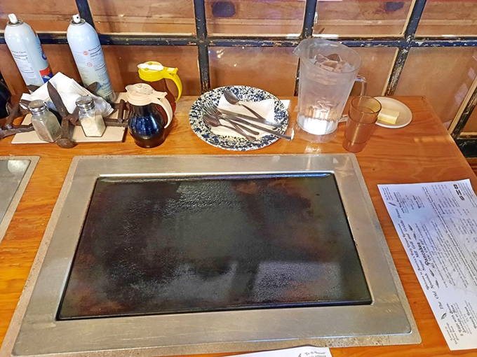 The tabletop griddle awaits its next pancake artist, seasoned with years of breakfast memories and maple-scented dreams.