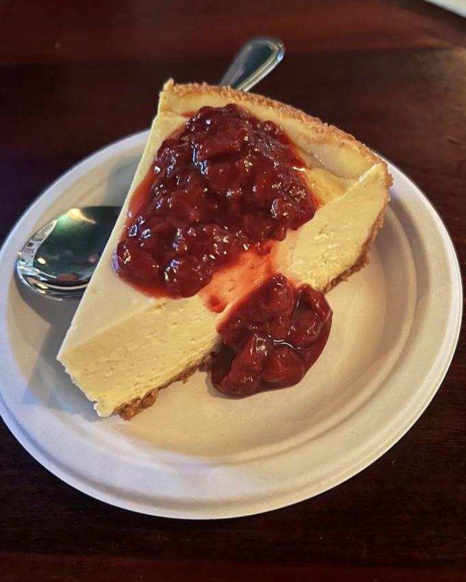 This cheesecake topped with berry compote is so heavenly, it might actually be what's keeping the ghosts around.
