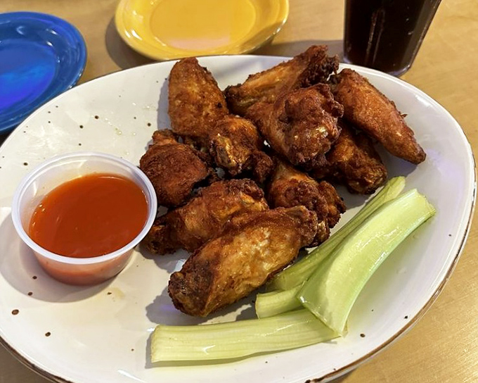 These wings aren't just fried, they're transformed – crispy, meaty morsels served with cooling celery sticks and sauce that demands finger-licking.