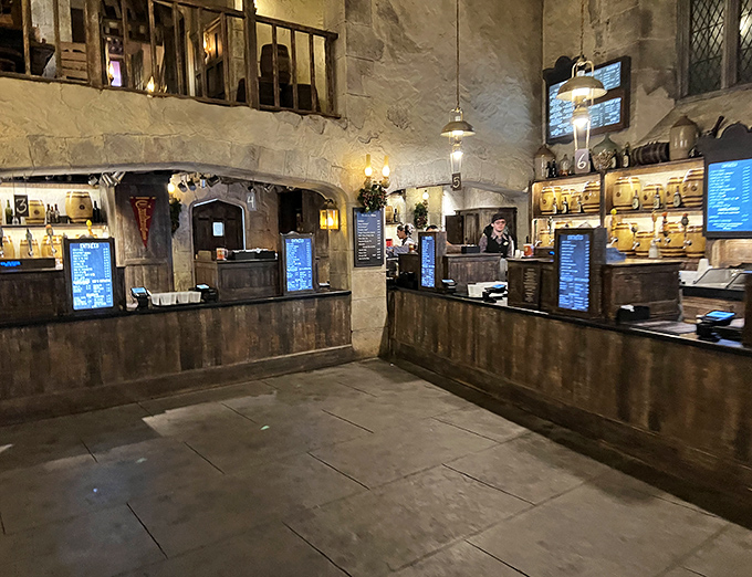The ordering counter feels plucked from Hogwarts itself, with wooden barrels and stone archways framing the magical menu boards.