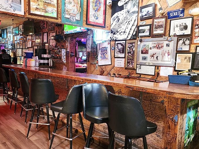 The bar area, where stories are shared and memories made, features a counter carved with decades of visitors' initials.