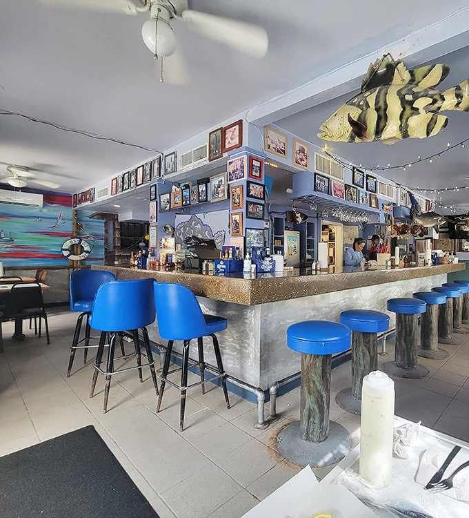 Blue stools and weathered wood create that perfect "come as you are" vibe where coastal casual isn't just allowed &ndash; it's encouraged.