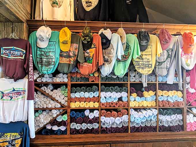 The merchandise wall organized by color makes leaving without a souvenir nearly impossible, especially in that perfect shade of seafoam.