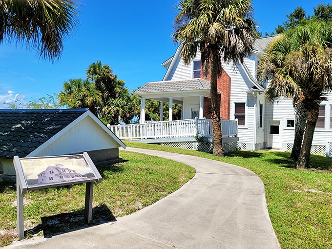 The historic Eldora House rises from ancient shell middens, its white facade a striking contrast to the lush Florida landscape.