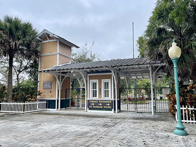 The museum entrance welcomes visitors with classic station architecture, palm trees swaying overhead as you prepare to embark on a journey through railroad history.