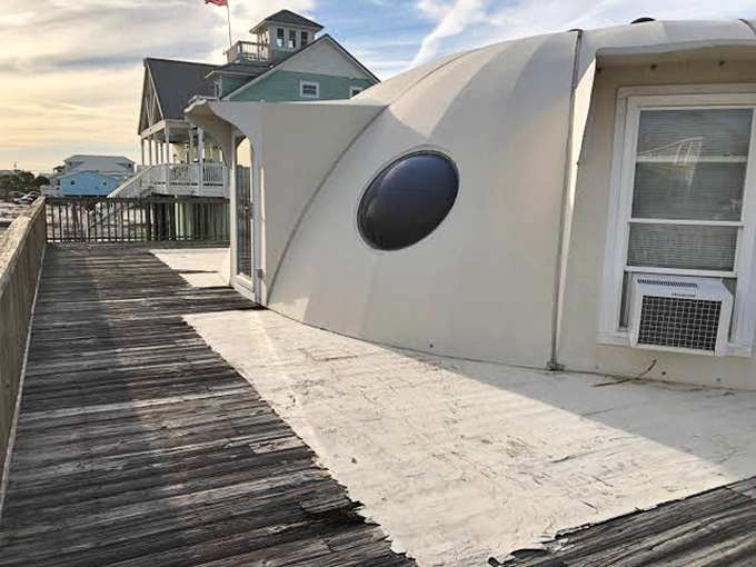 The wraparound deck offers observation-deck views of the Gulf, perfect for spotting dolphins or pretending you're scanning for distant galaxies.