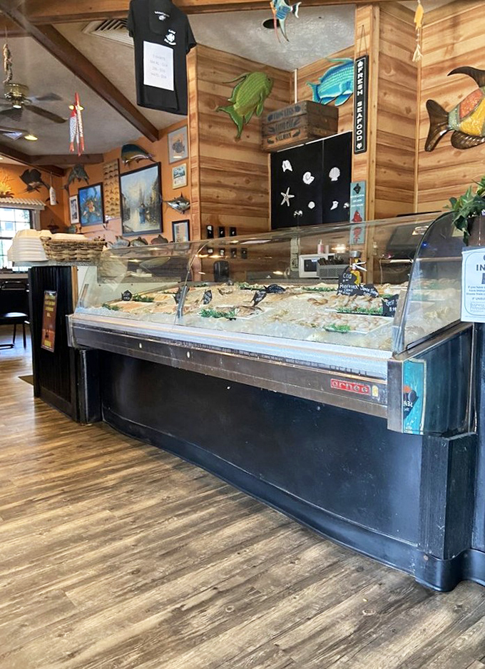 The fresh fish case showcases the day's catch, a glistening display of Gulf treasures that reminds you this is both restaurant and market.