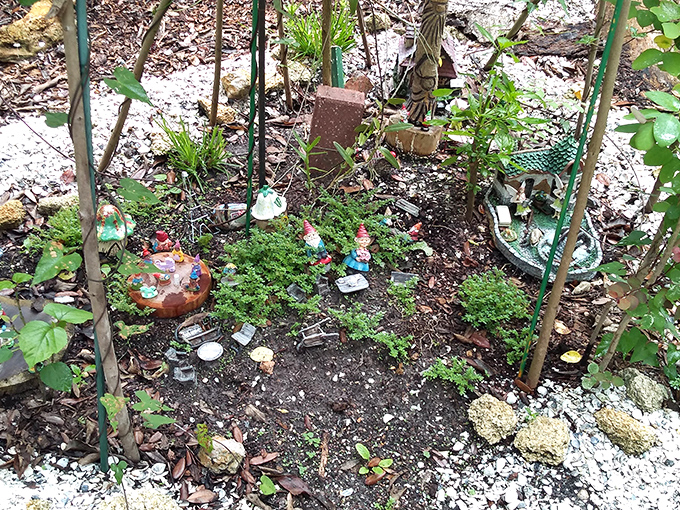 Multiple gnome residences creating a vertical village that would make any urban planner weep with joy at the efficient use of space and creative architectural solutions.