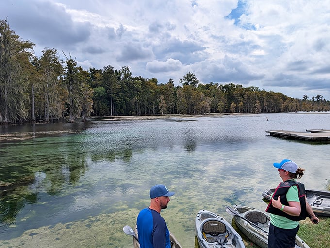 Kayakers prepare for adventure on crystal waters, where paddling feels more like flying than floating.